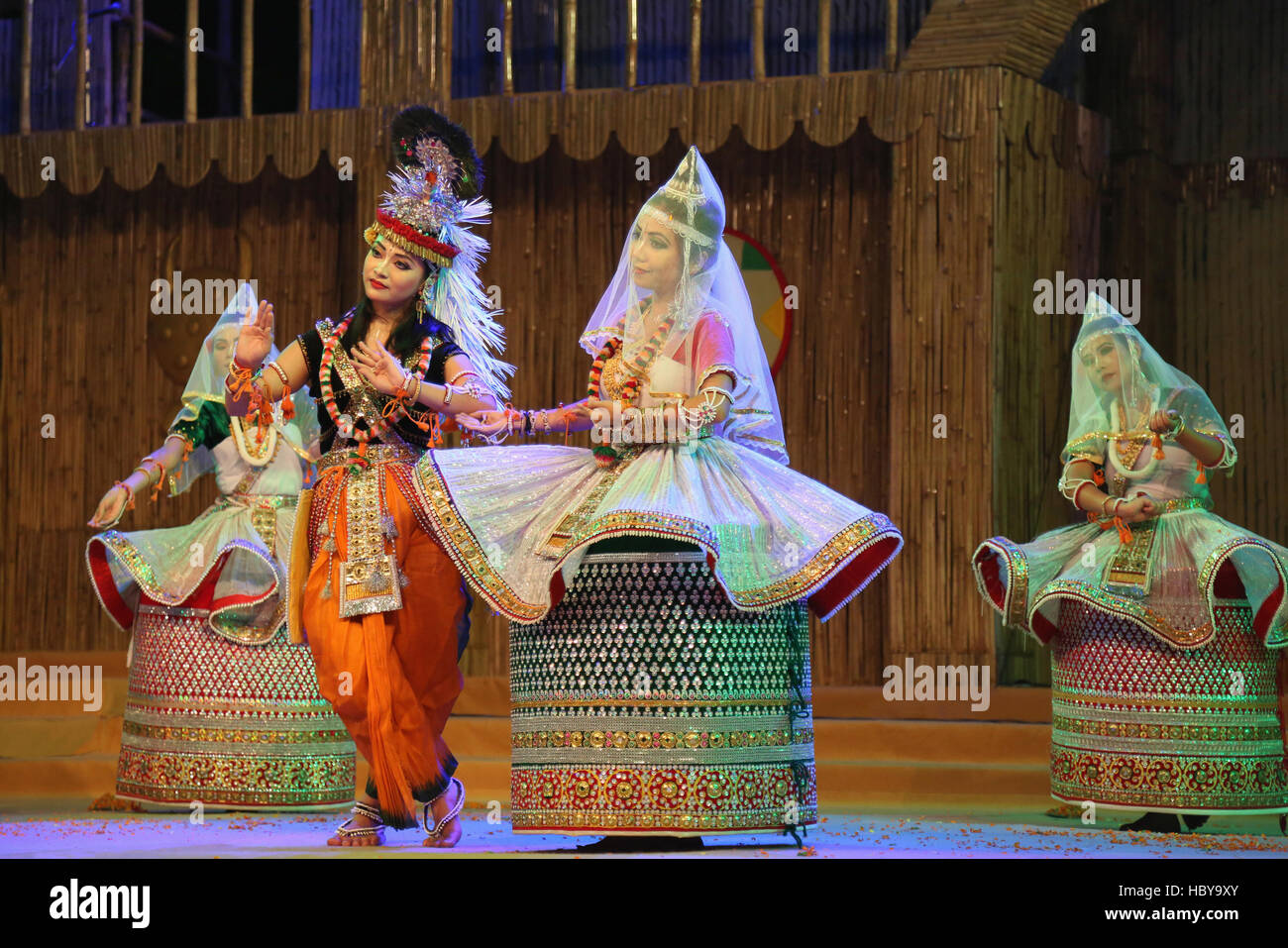 A dance group of Manipur dancers performing Manipur Rass dance on stage ...