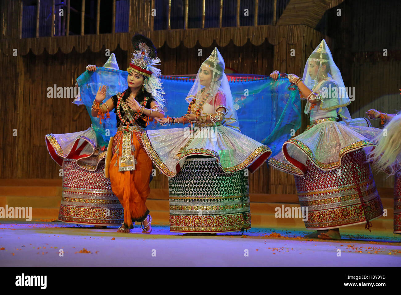 A dance group of Manipur dancers performing Manipur Rass dance on stage ...