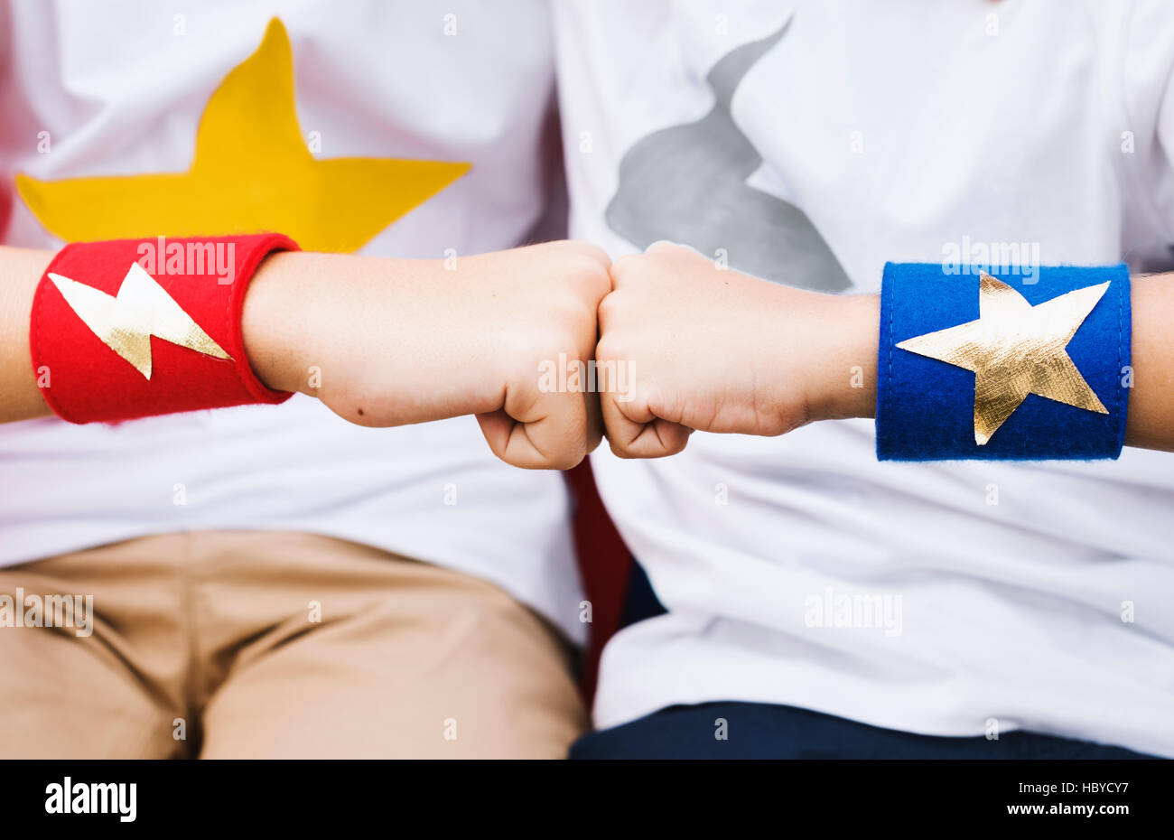 Superheroes Kids Fist Bump Powerful Concept Stock Photo - Alamy