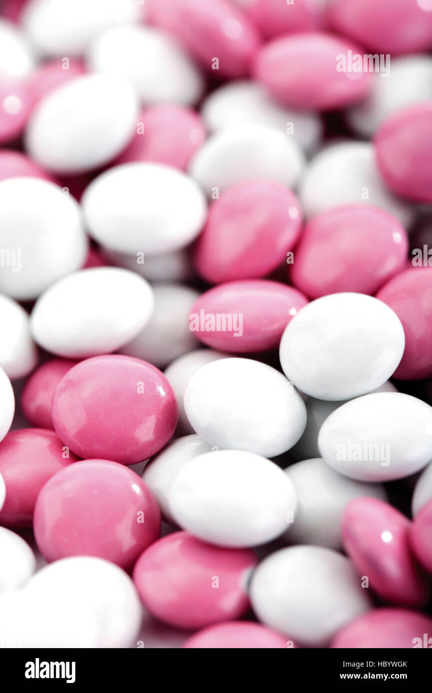 Pink and white chocolate beans Stock Photo - Alamy