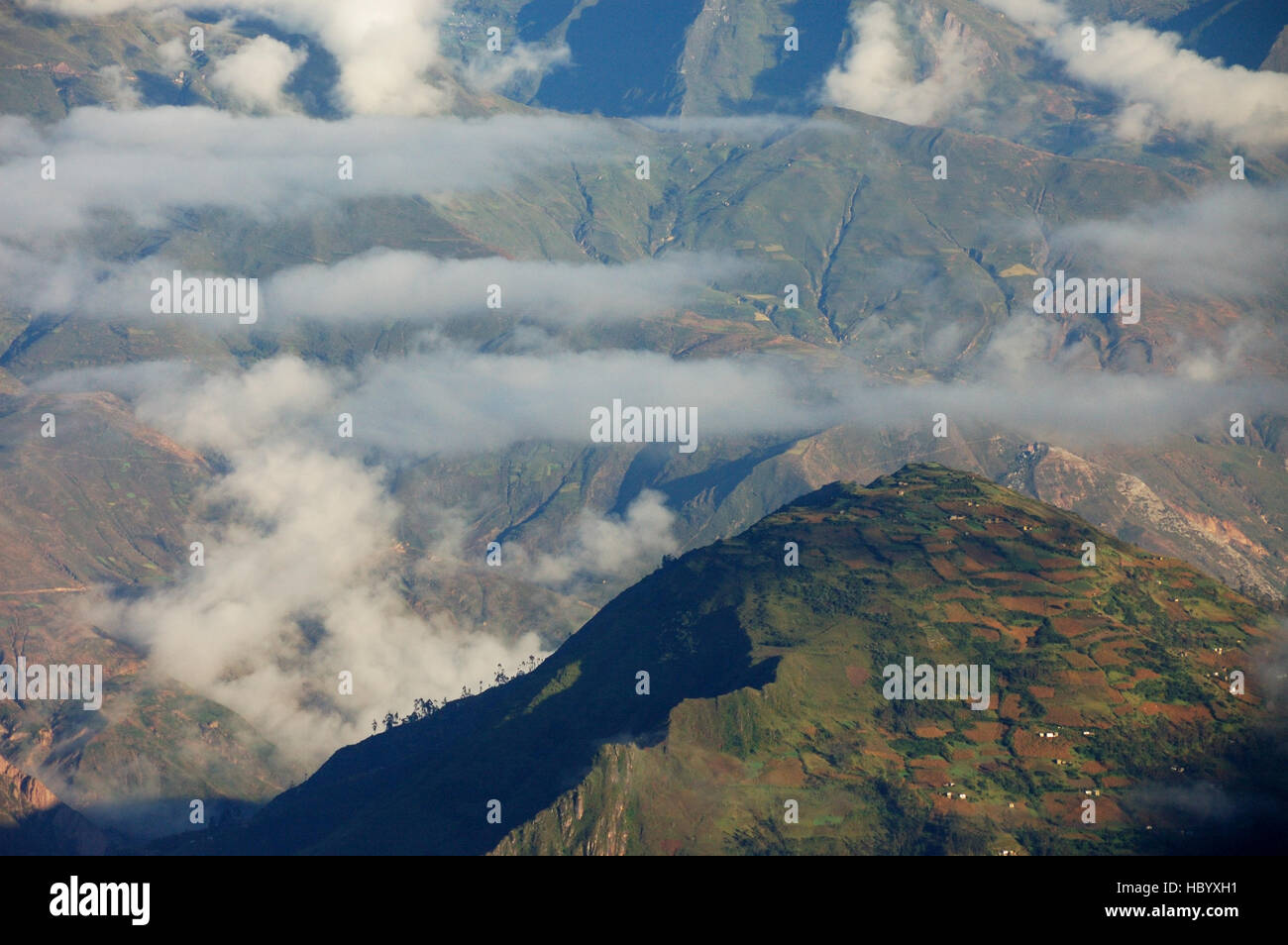 Foothills in the clouds, seen from Laguna Chillata near Mt. Illampu ...