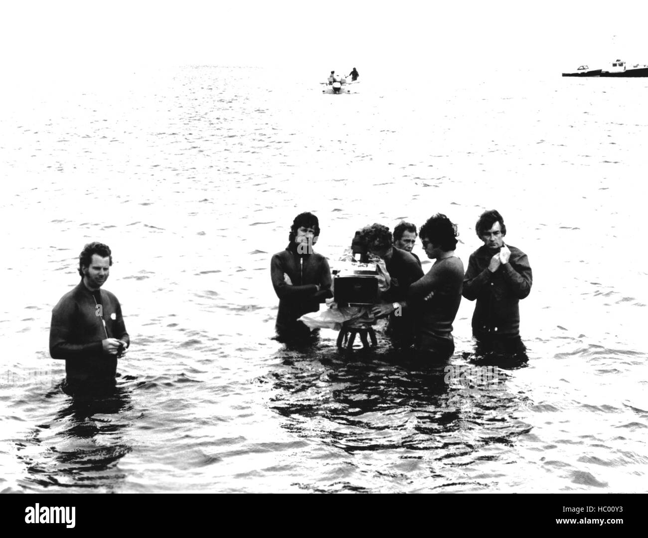 JAWS, director Steven Spielberg, (center, arms folded), on location ...