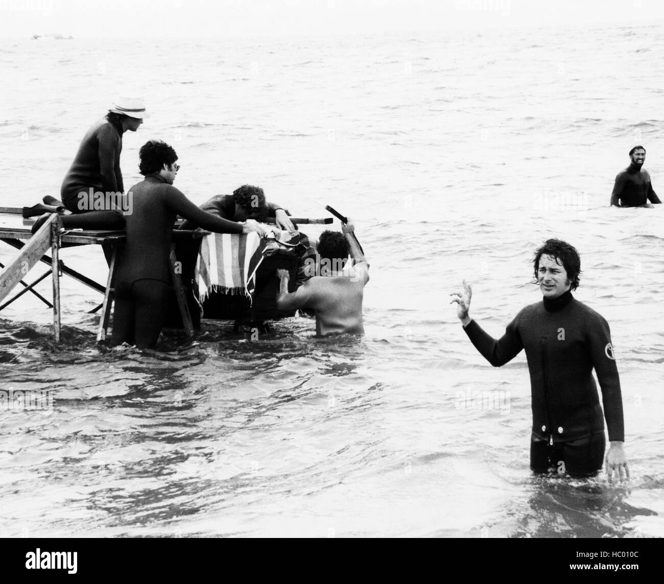 JAWS, director Steven Spielberg, (front right), on location, 1975 Stock ...