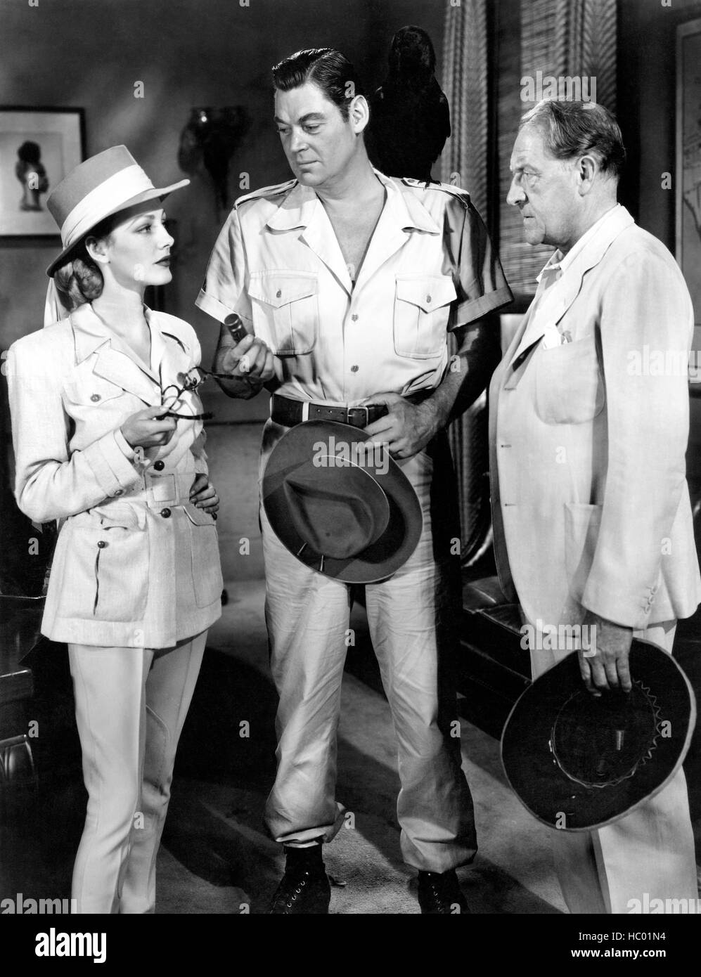JUNGLE JIM, l-r: Virginia Grey, Johnny Weissmuller, Holmes Herbert, 1948 Stock Photo - Alamy