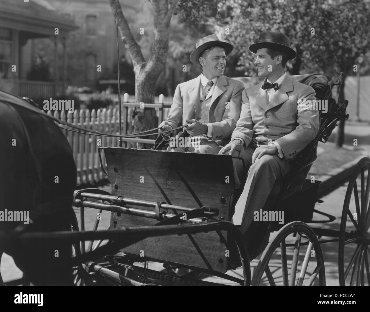 KINGS ROW, from left: Ronald Reagan, Robert Cummings, 1942 Stock Photo ...