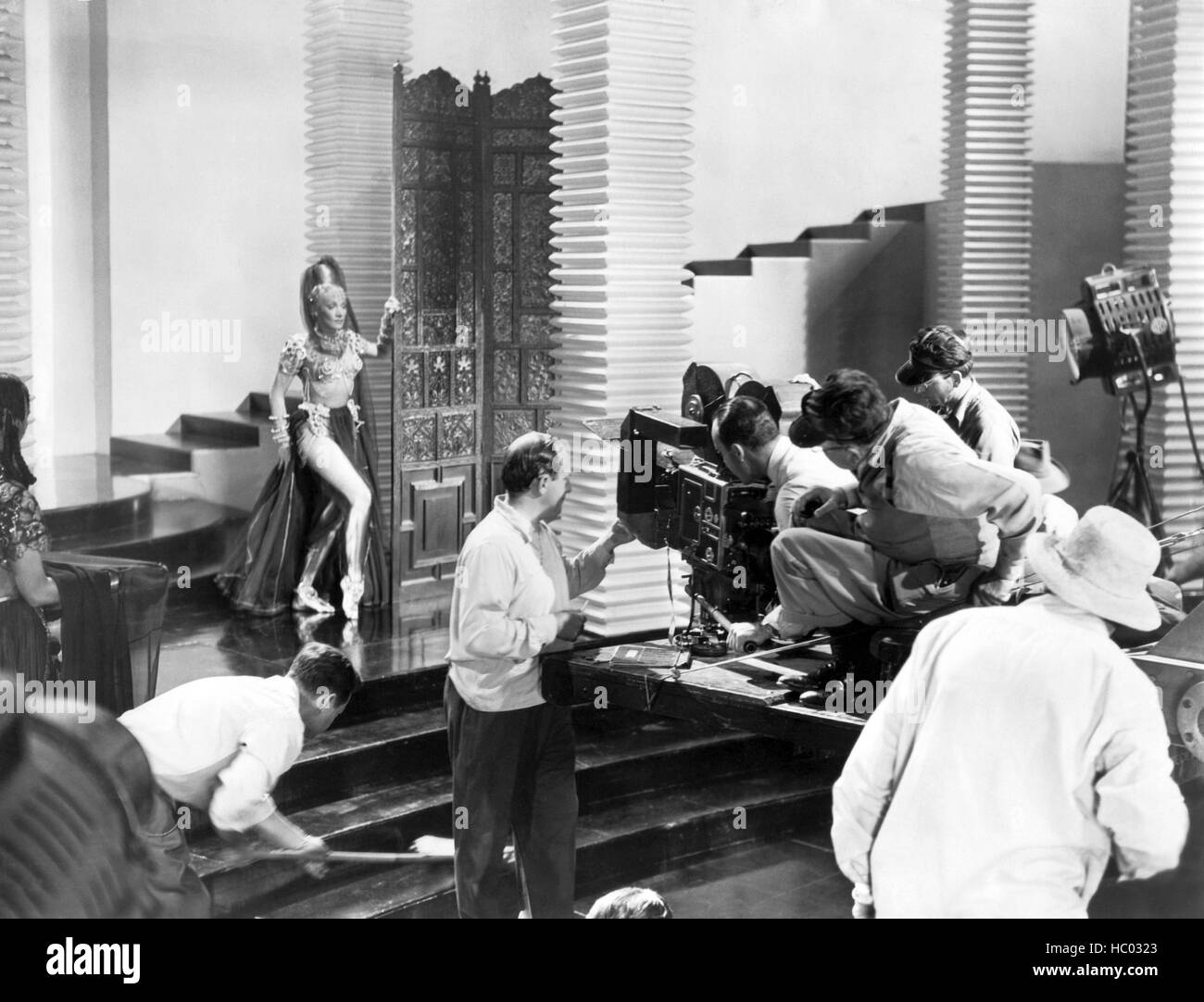 KISMET, Marlene Dietrich (left), director William Dieterle (back to ...