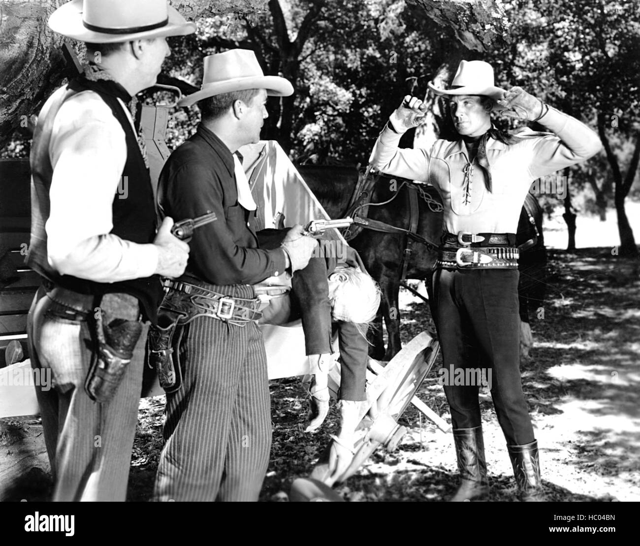 LAW OF THE SADDLE, second and third from left: Reed Howes, Robert ...