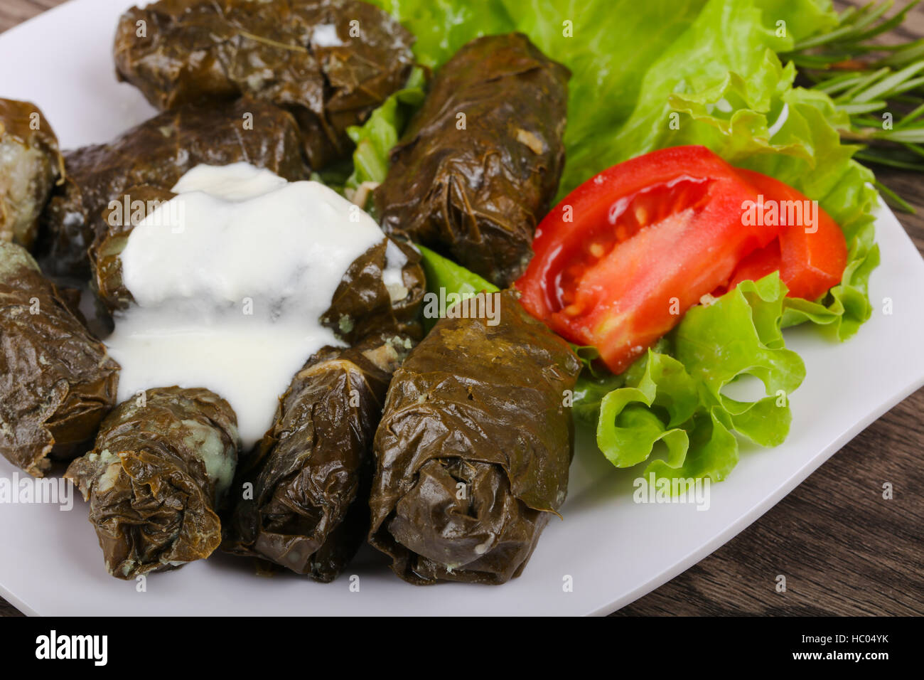 Dolma - stuffed meat in grape leaves with cream sauce Stock Photo - Alamy Dolma - stuffed meat in grape leaves with cream sauce Stock Photo - Alamy
