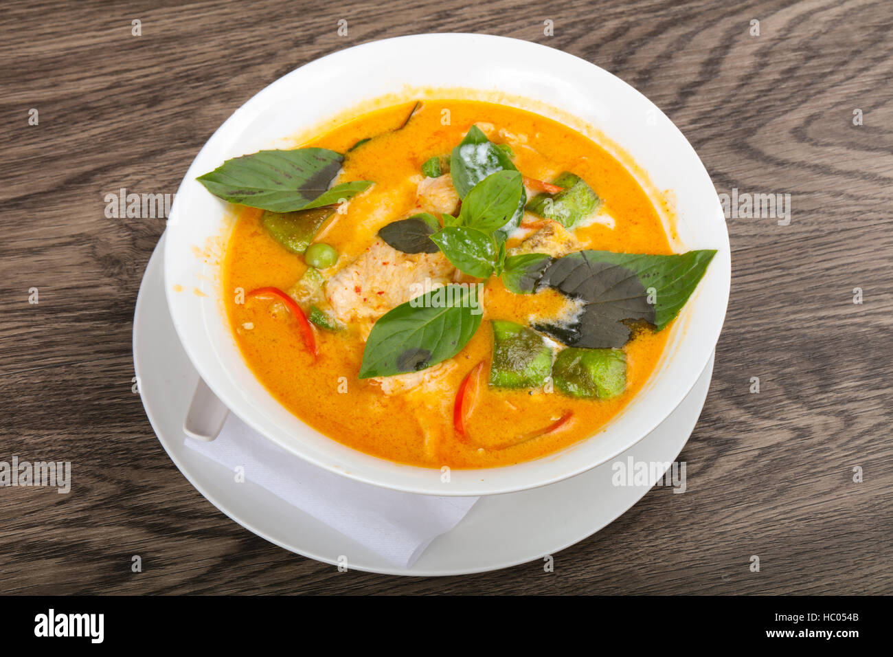Red curry with basil leaves and chicken Stock Photo - Alamy