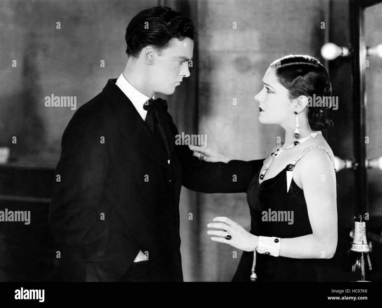 THE LOVE OF SUNYA, from left, Raymond Hackett, Gloria Swanson, (in a ...