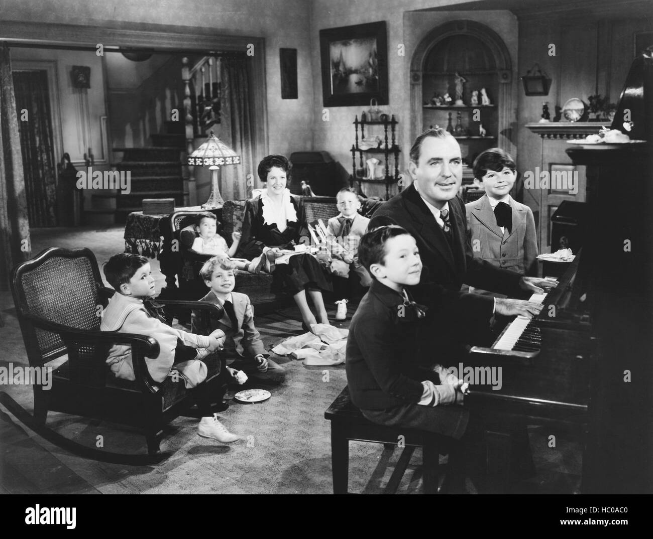 THE IRON MAJOR, Pat O'Brien (front center), Ruth Warrick (on couch ...