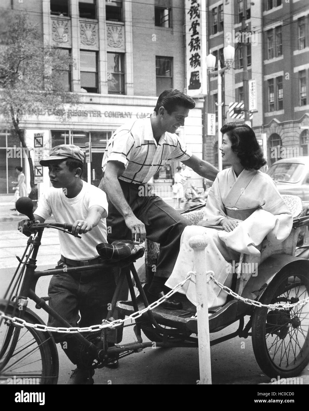 JOE BUTTERFLY, John Agar, Reiko Arai, on location in Tokyo, 1957 Stock ...