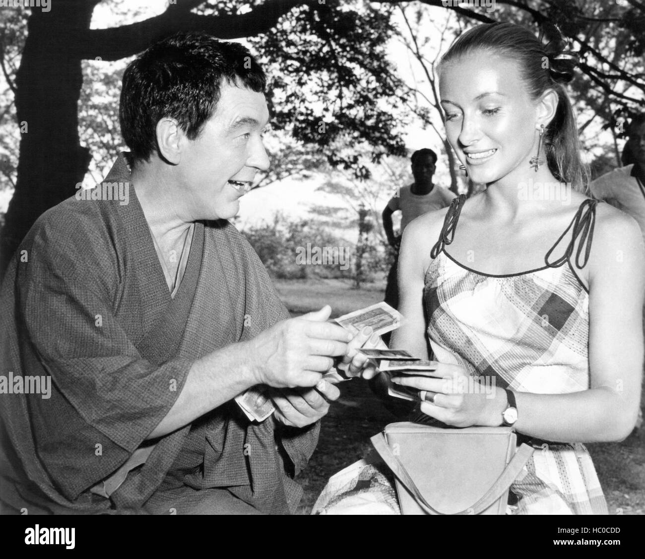 JOE BUTTERFLY, Burgess Meredith (left) explains Japanese currency to ...