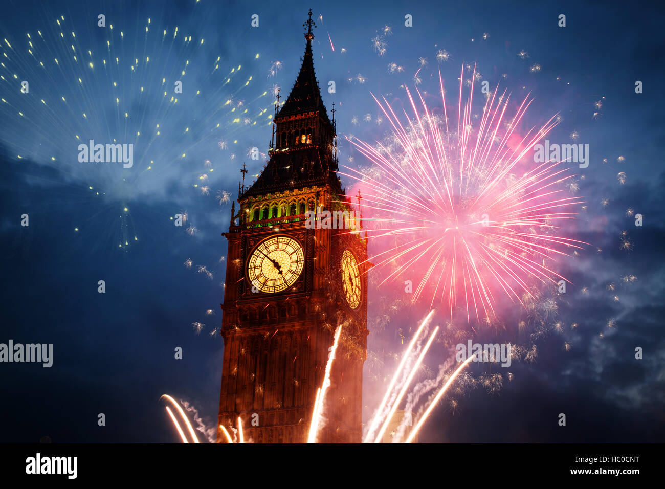 explosive fireworks display fills the sky around Big Ben. New Year's ...