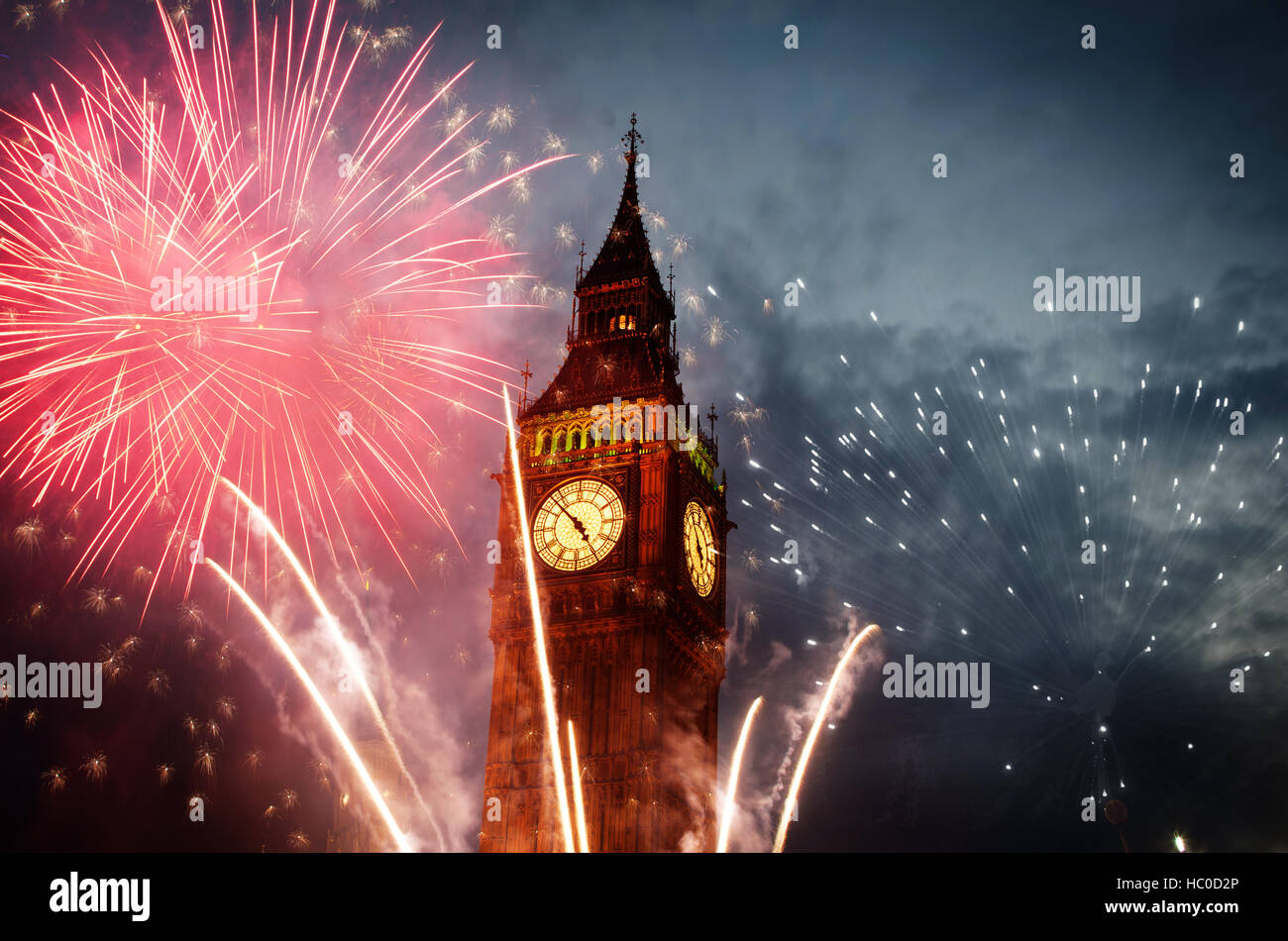 explosive fireworks display fills the sky around Big Ben. New Year's ...