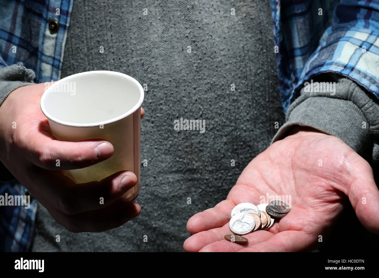 homeless man hand help Stock Photo - Alamy