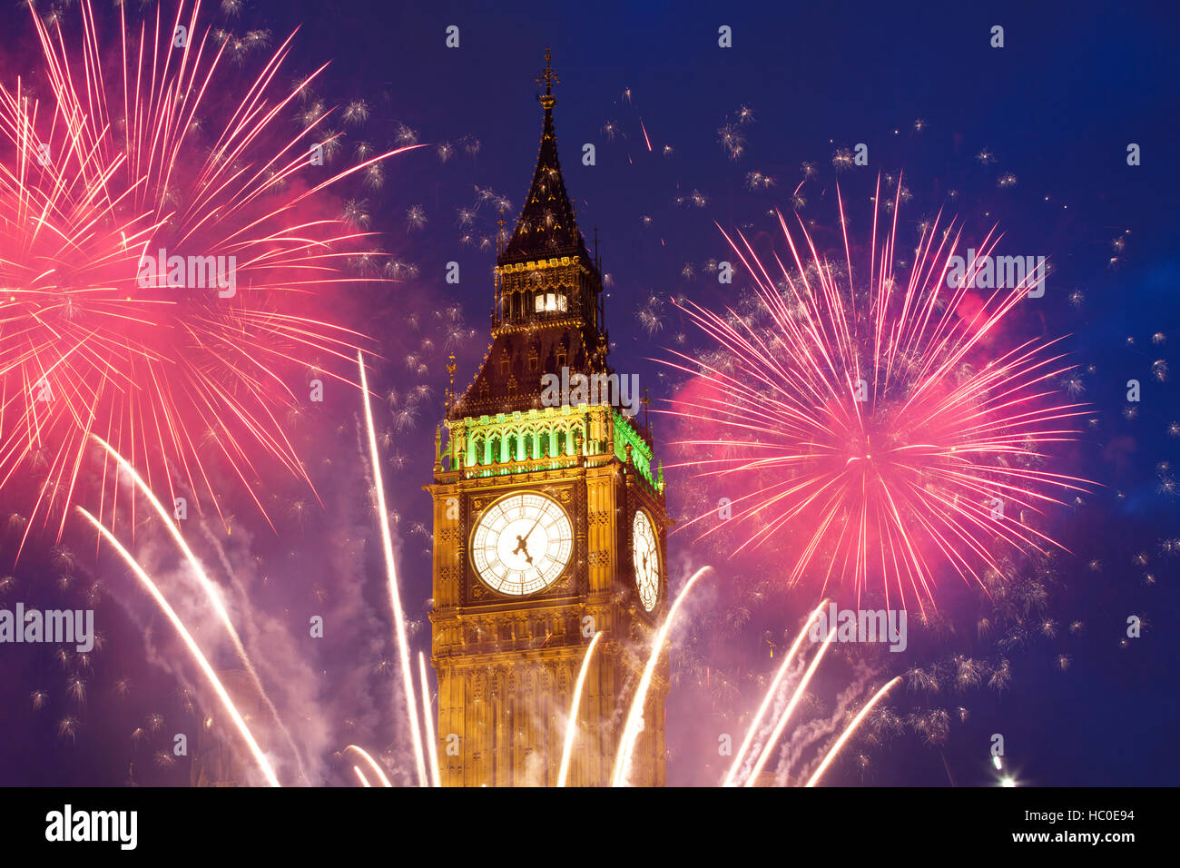 explosive fireworks display fills the sky around Big Ben. New Year's ...