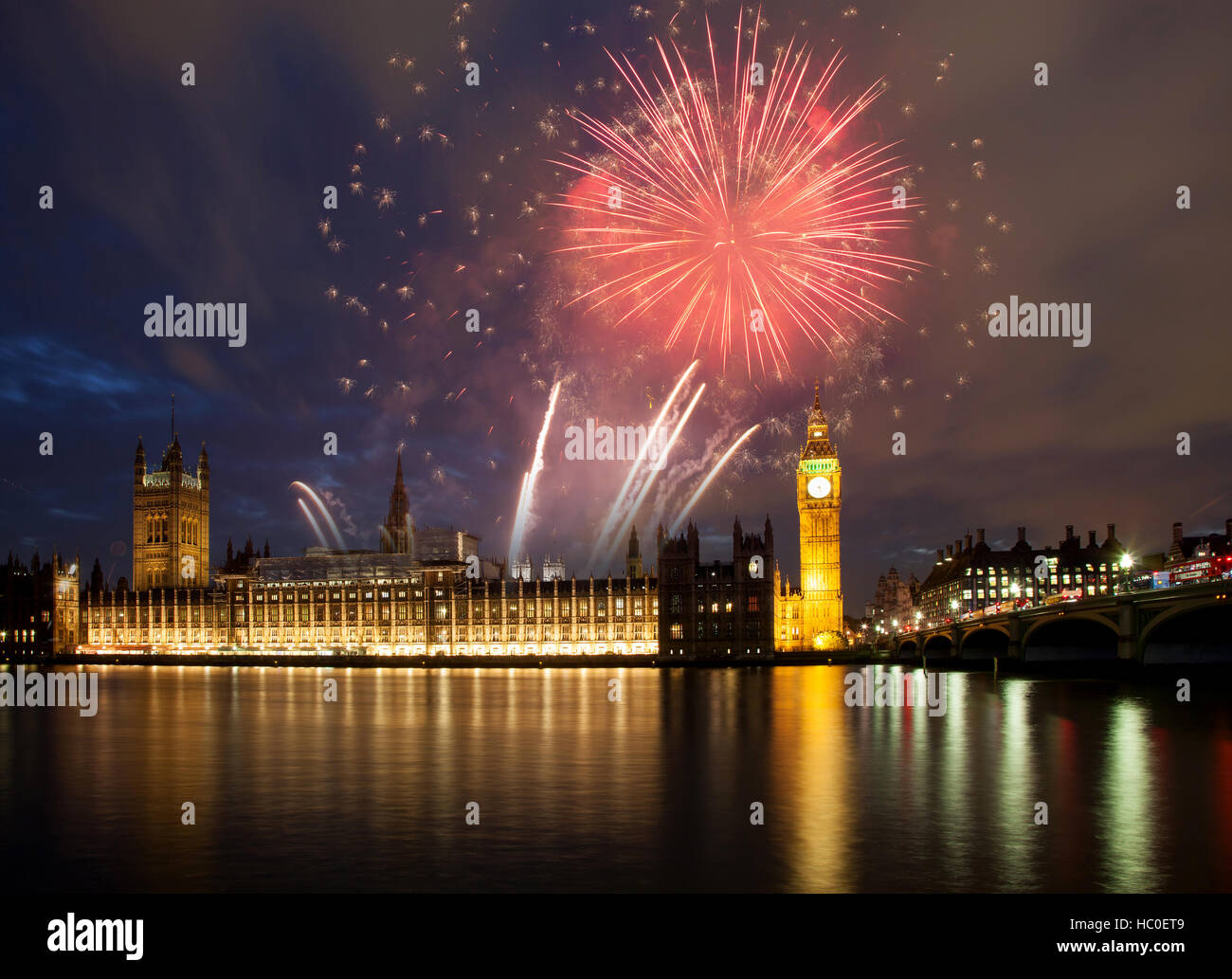 explosive fireworks display fills the sky around Big Ben. New Year's ...
