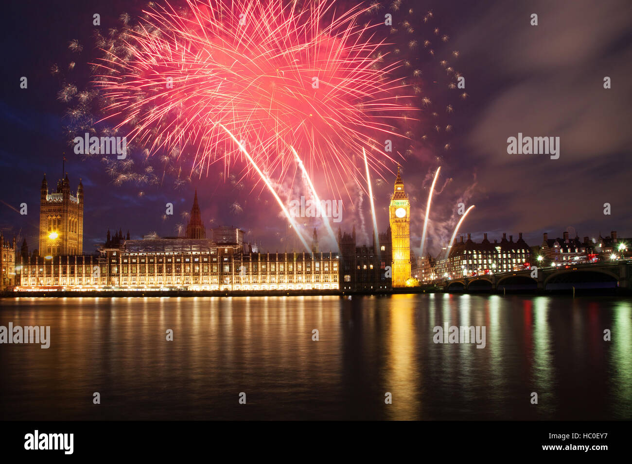 explosive fireworks display fills the sky around Big Ben. New Year's ...