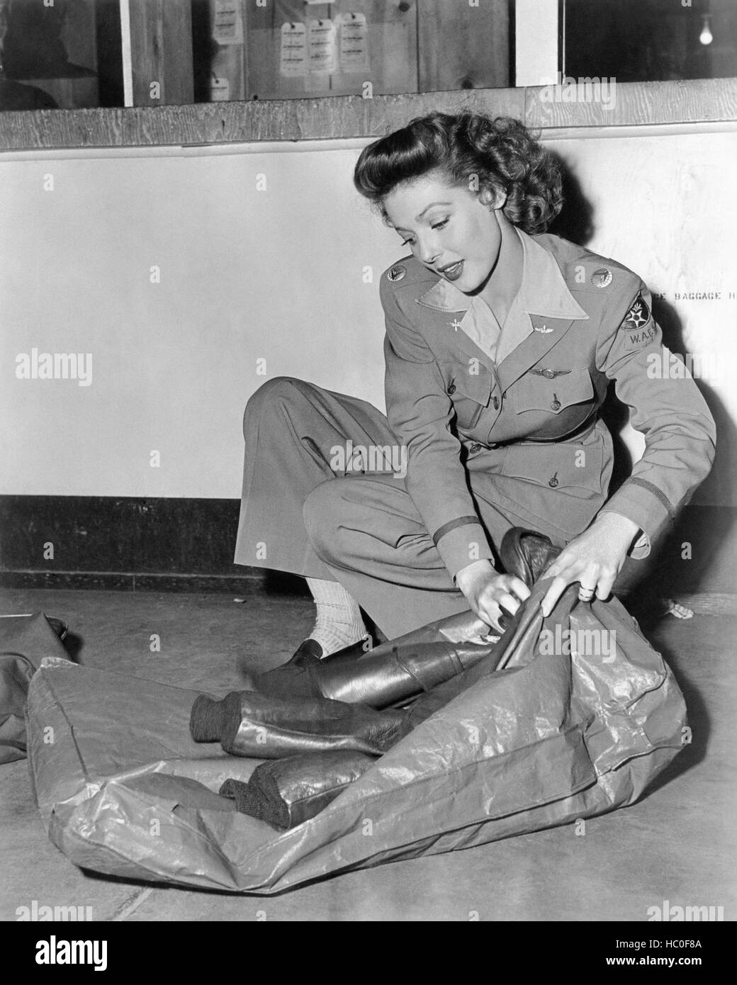 LADIES COURAGEOUS, Loretta Young, packing for location filming on a ...