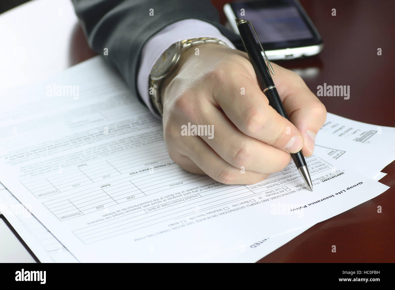 hand signed insurance Stock Photo - Alamy