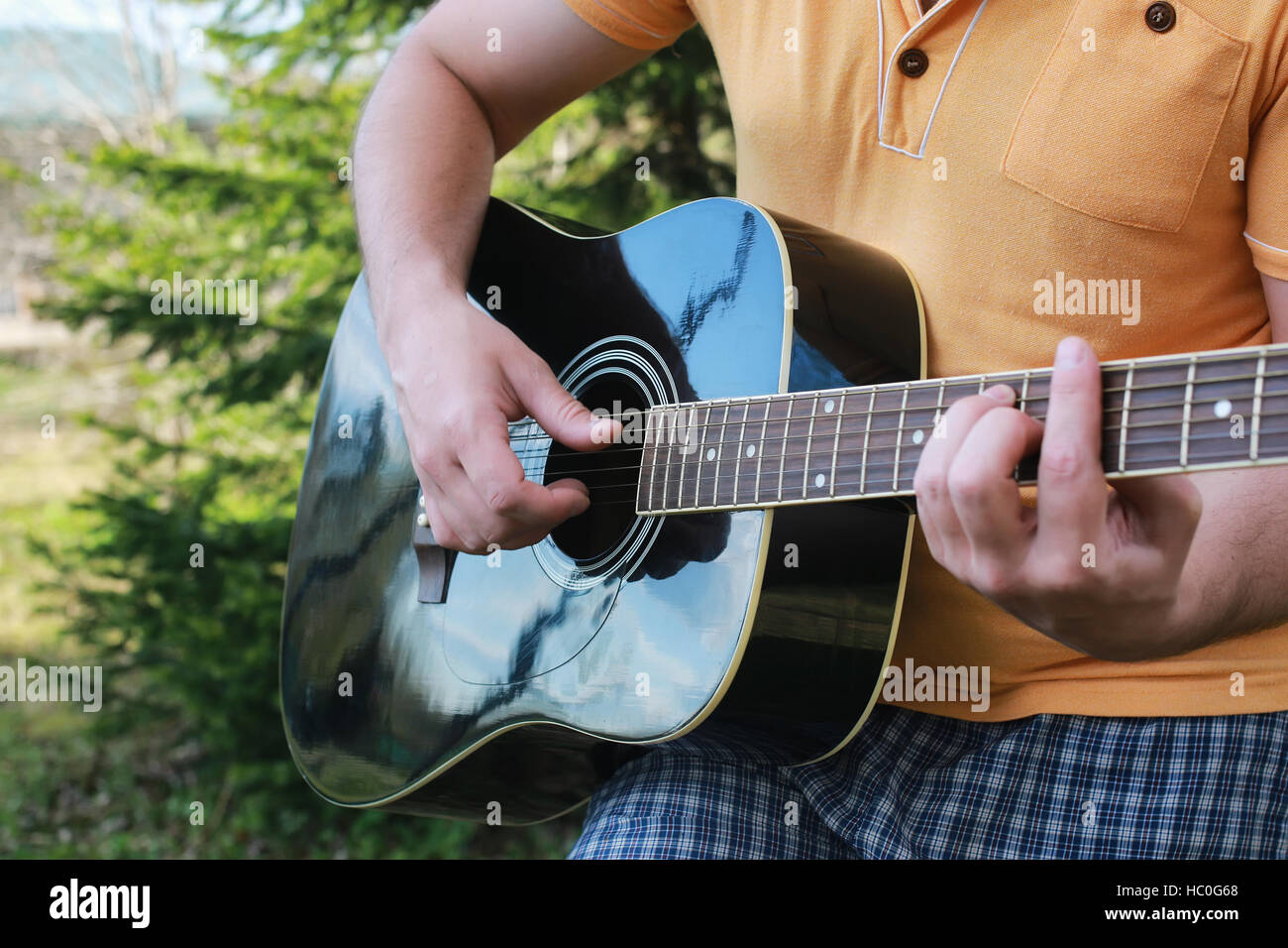 guitar string man hand outdoor Stock Photo - Alamy