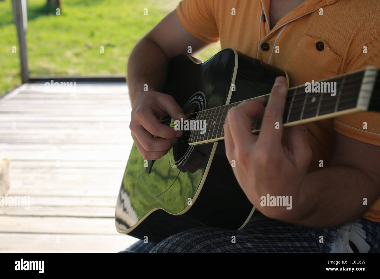 guitar string man hand outdoor Stock Photo - Alamy