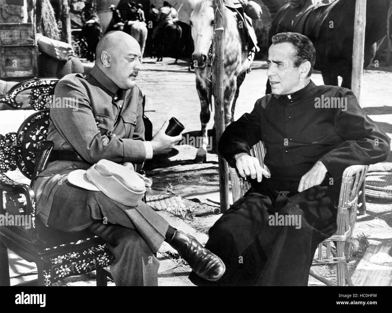 THE LEFT HAND OF GOD, from left: Lee J. Cobb, Humphrey Bogart, on set ...