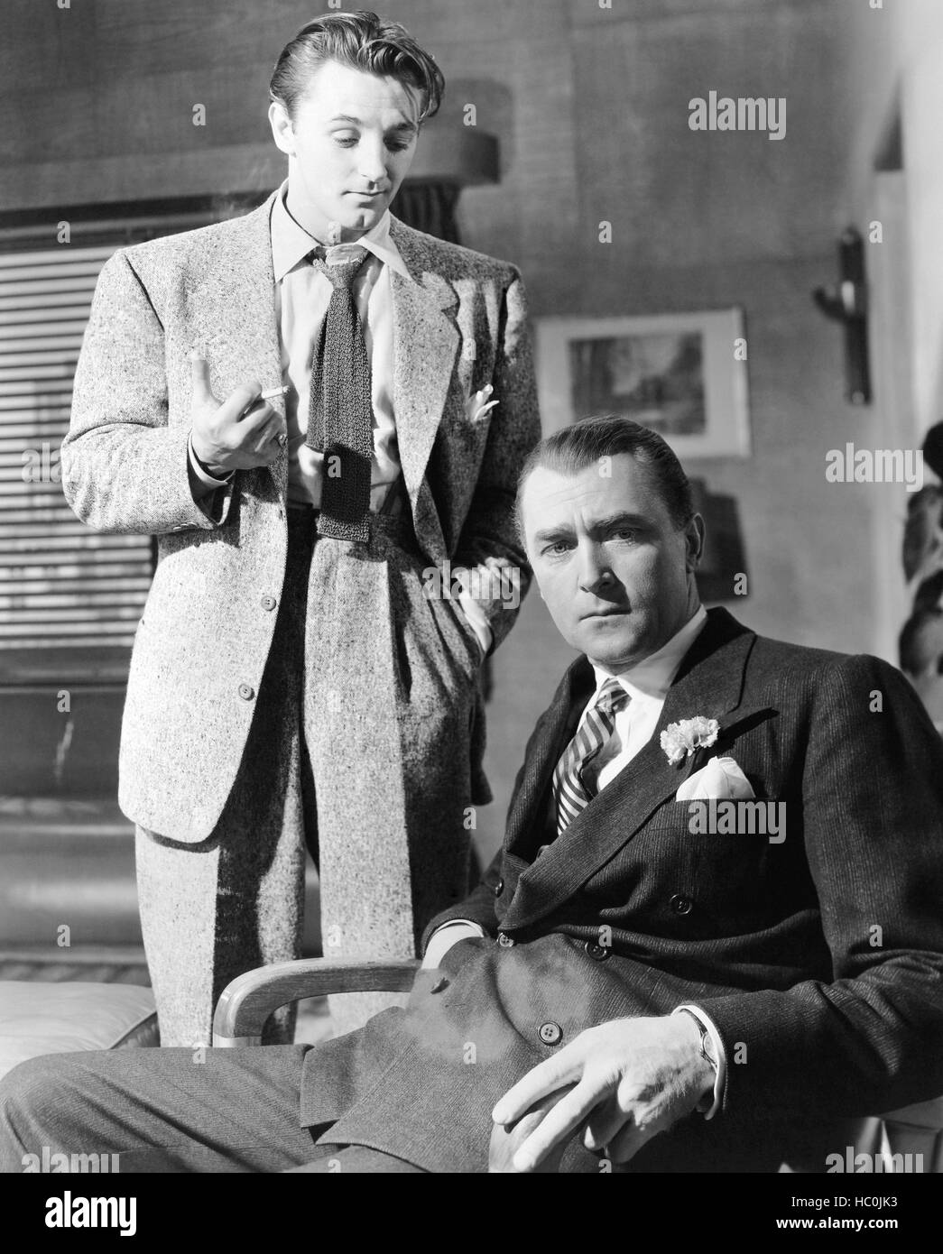 THE LOCKET, from left, Robert Mitchum, Brian Aherne, 1946 Stock Photo ...