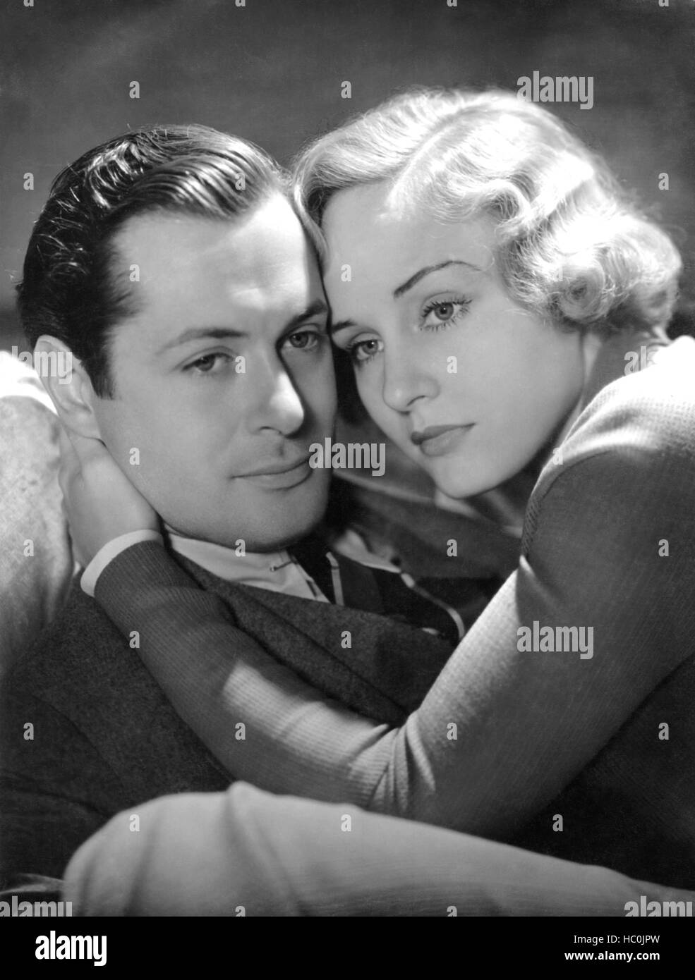 LOVERS COURAGEOUS, from left: Robert Montgomery, Madge Evans; MGM portrait by Hurrell, 1932 ...