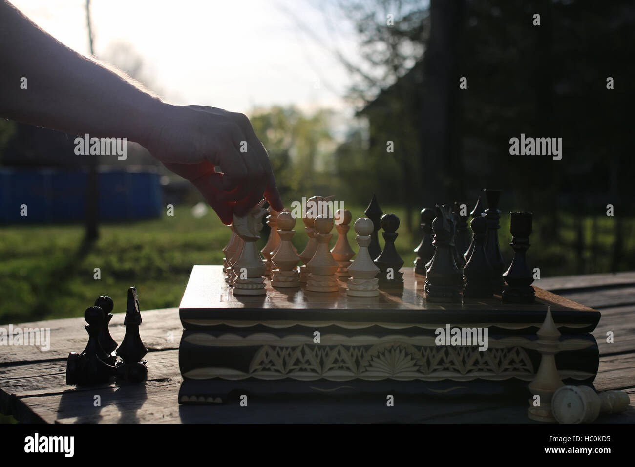 chess man hand outdoor Stock Photo - Alamy
