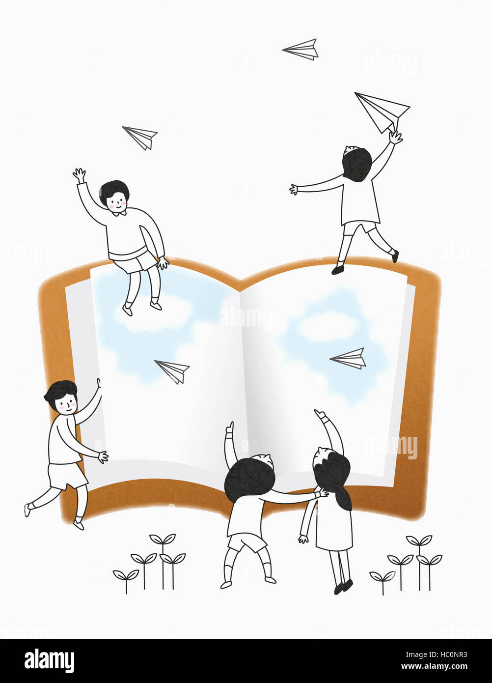Smiling children flying paper airplanes with an open book Stock Photo ...