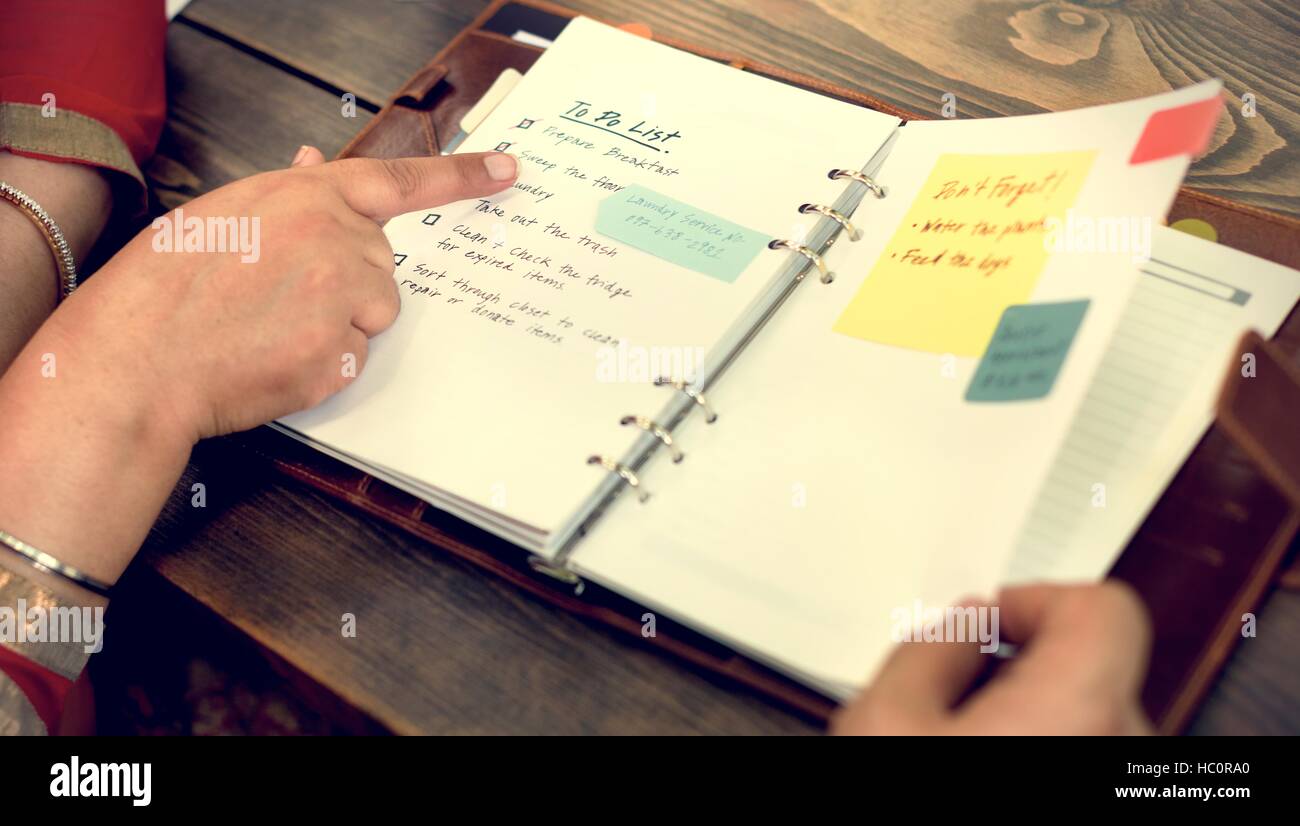Indian Couple Checking To Do List Concept Stock Photo - Alamy