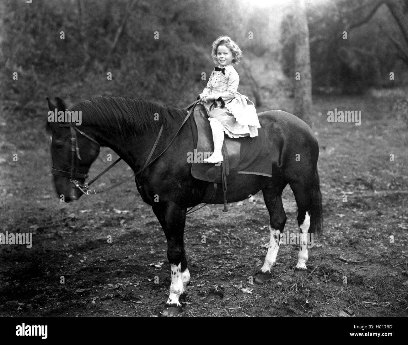 THE LITTLEST REBEL, Shirley Temple, 1935, on horseback. TM and ...