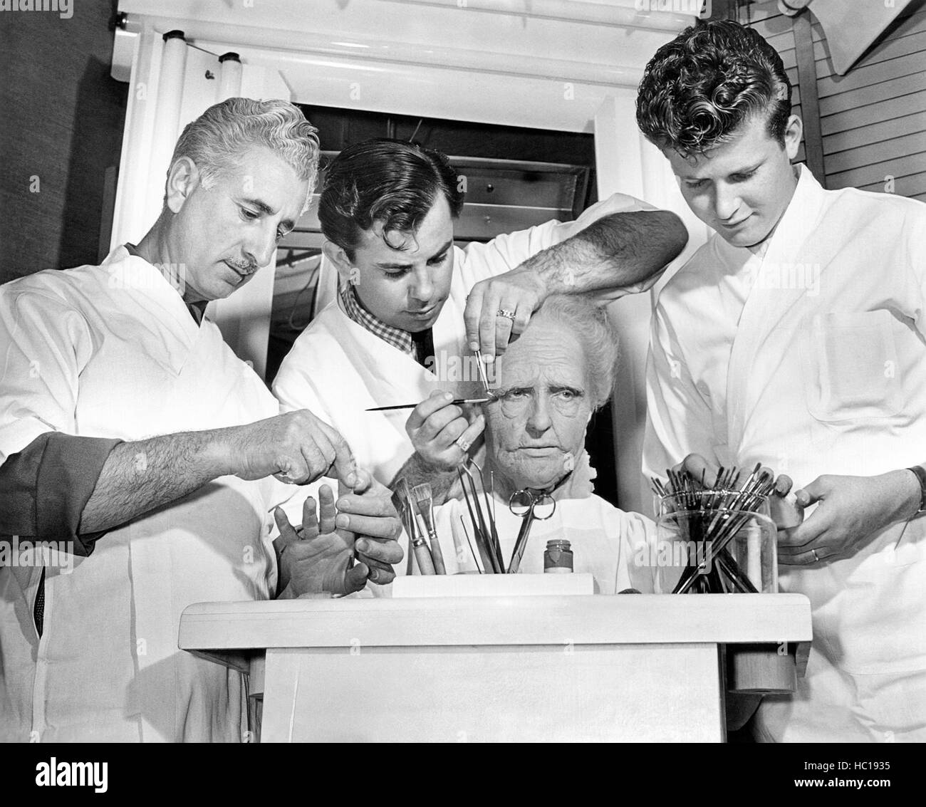THE LOST MOMENT, from left; makeup artists Lou LaCava, Bud Westmore ...