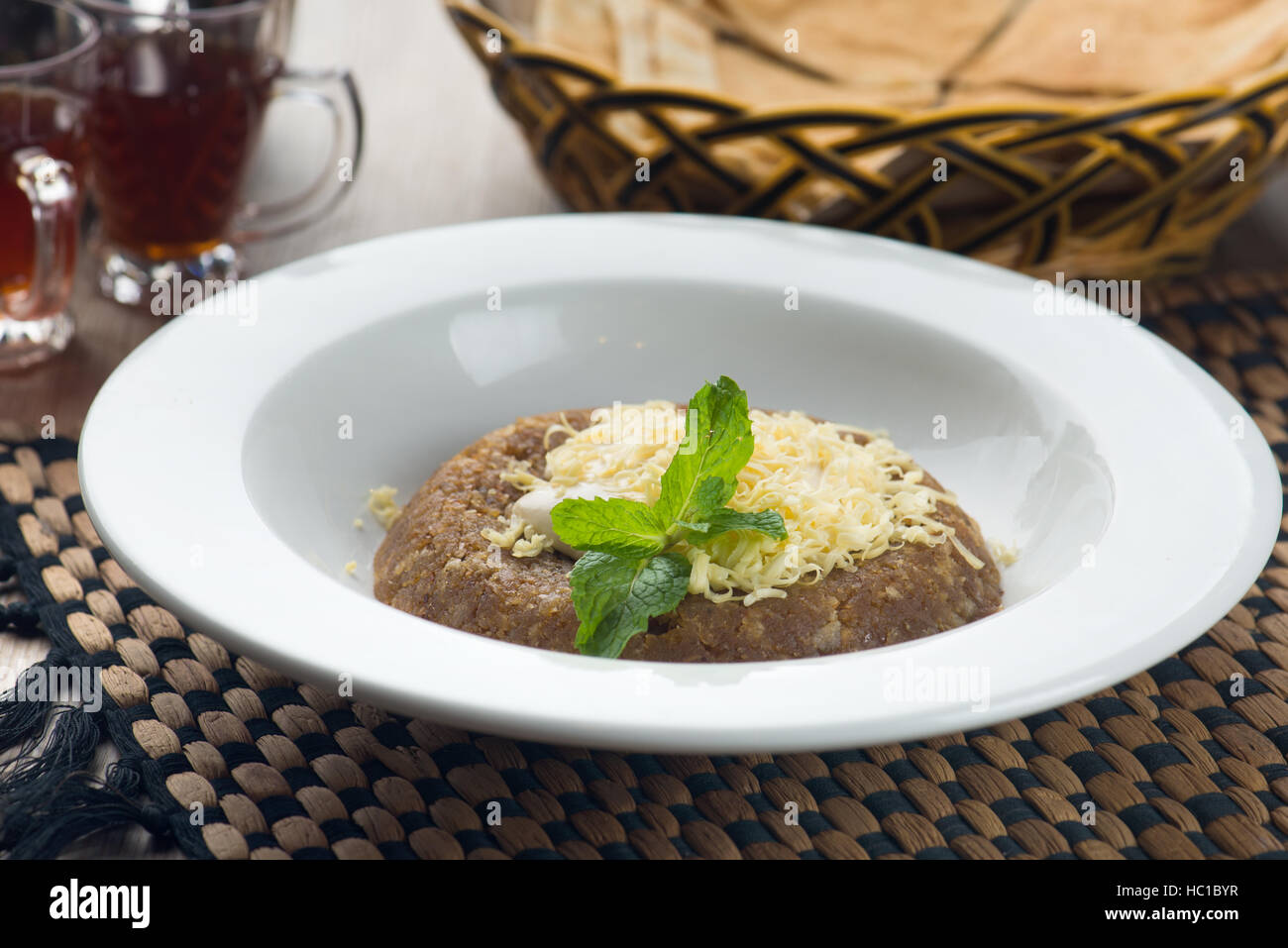 oqda , fried potatoes with meat popular arab food Stock Photo - Alamy