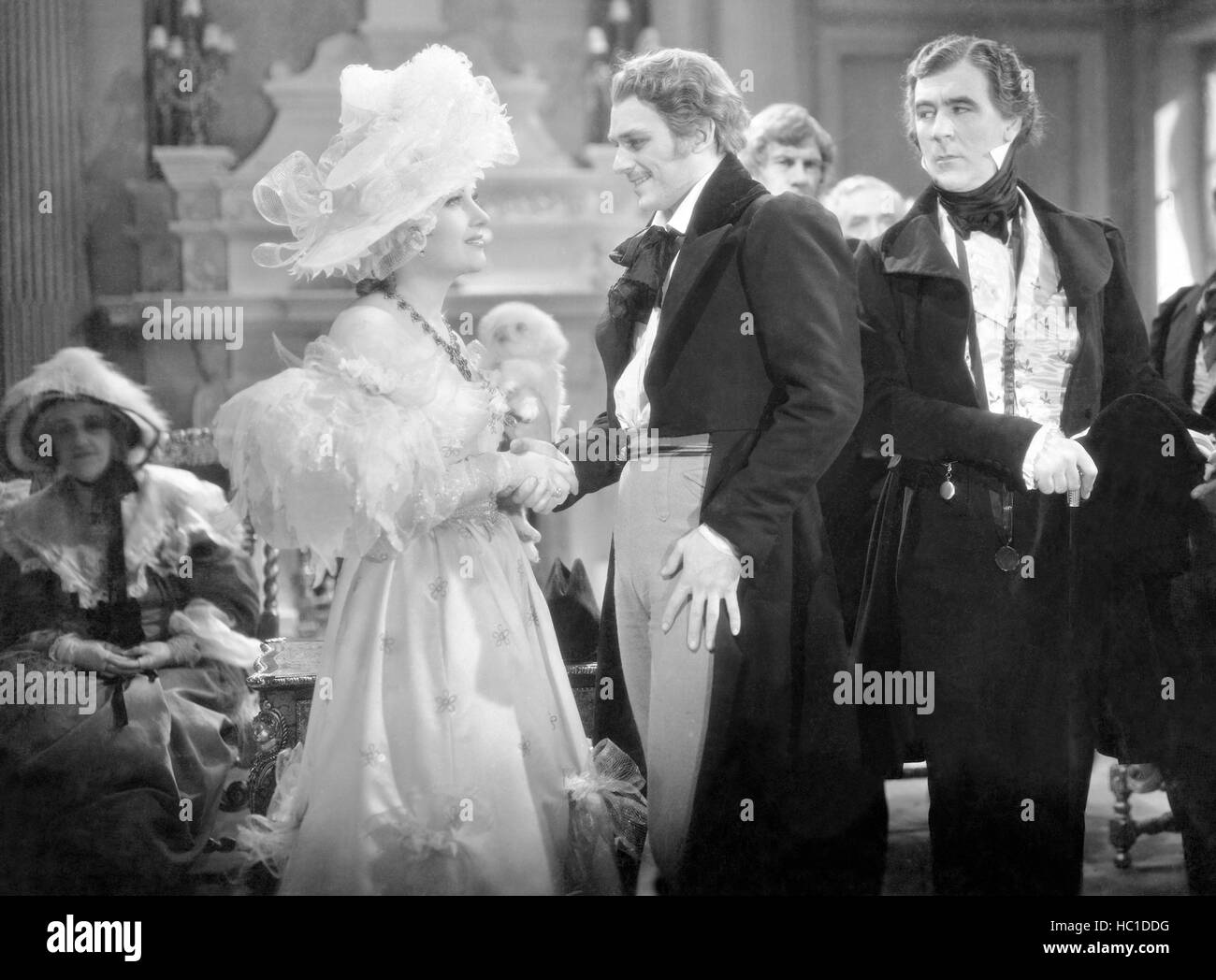 MIMI, from left: Diana Napier, Douglas Fairbanks Jr., Austin Trevor, 1935 Stock Photo - Alamy