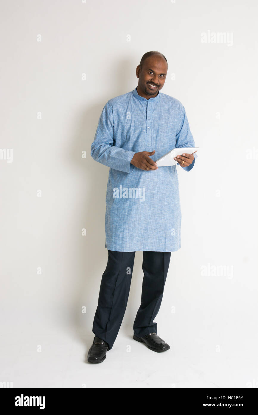 traditional indian male using tablet indoor Stock Photo - Alamy
