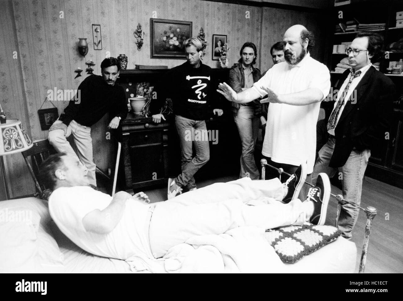 MISERY, James Caan (in bed), director Rob Reiner (arms outstretched) on ...