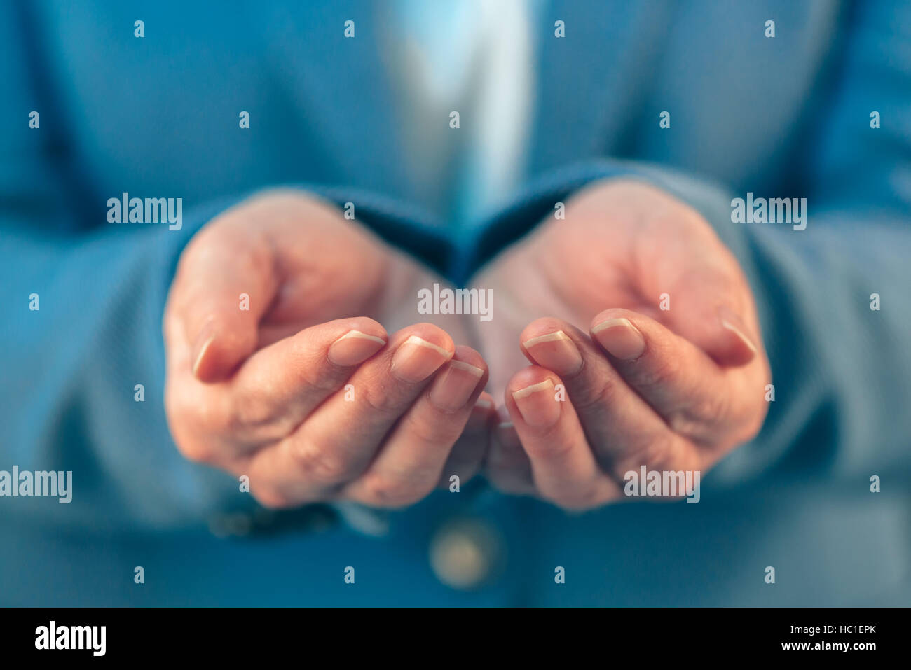 Businesswoman with open palms of her hands asking for something Stock ...