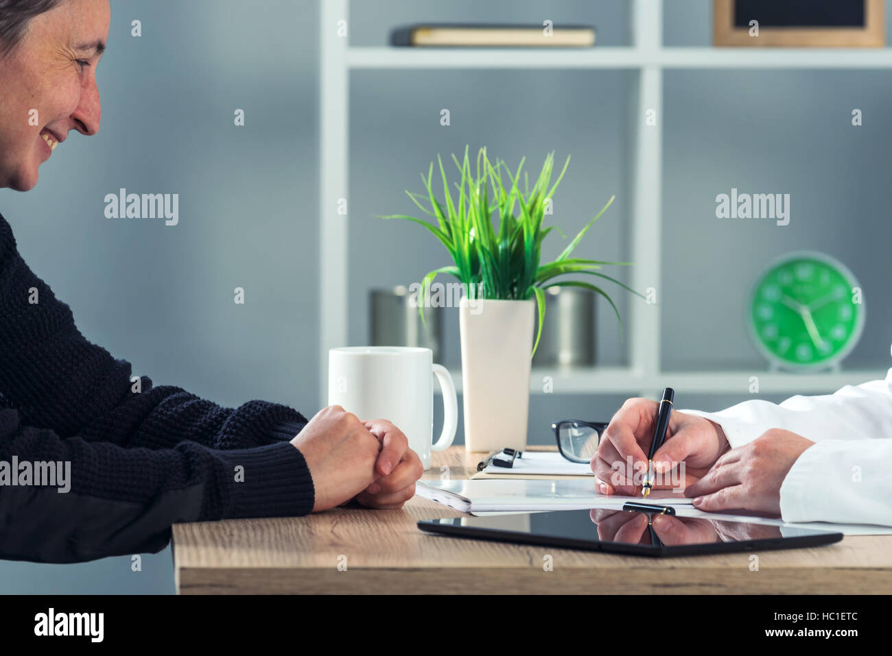 Happy female patient doctor hi-res stock photography and images - Alamy