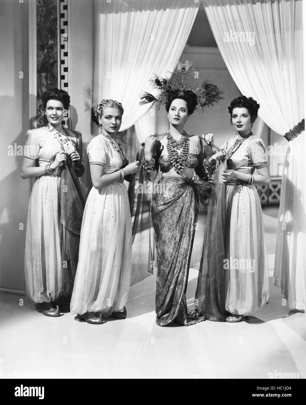 NIGHT IN PARADISE, from left: Roseanne Murray, Jean Trent, Merle Oberon ...