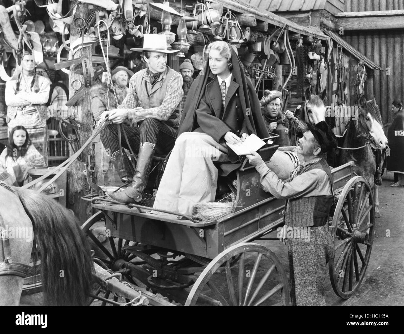 NORTH WEST MOUNTED POLICE, in wagon from left: Gary Cooper, Madeleine ...