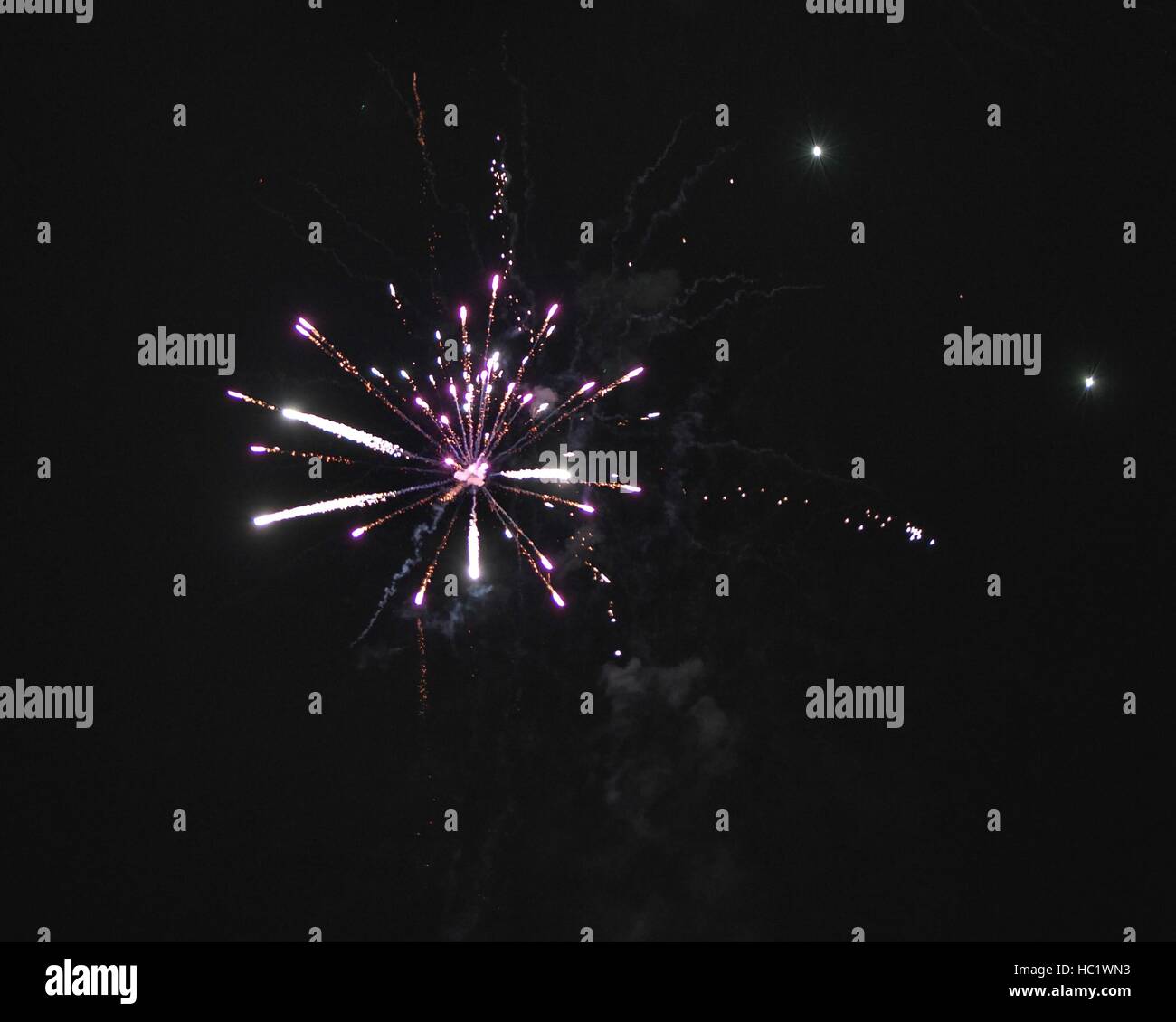 Shiny natural fireworks on dark sky background with little smoke Stock ...