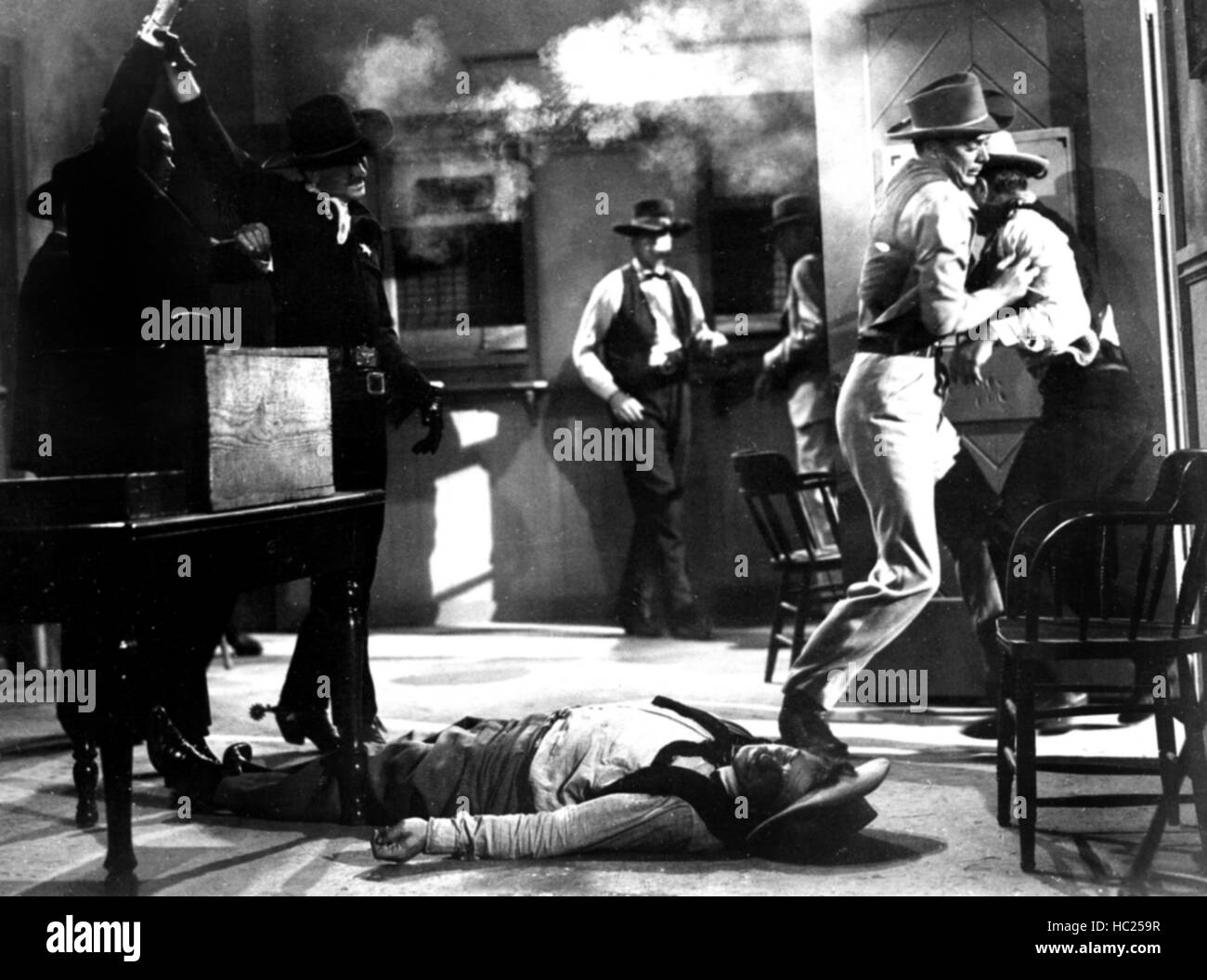 MARSHAL OF GUNSMOKE, Tex Ritter (left, arm raised), Russell Hayden ...