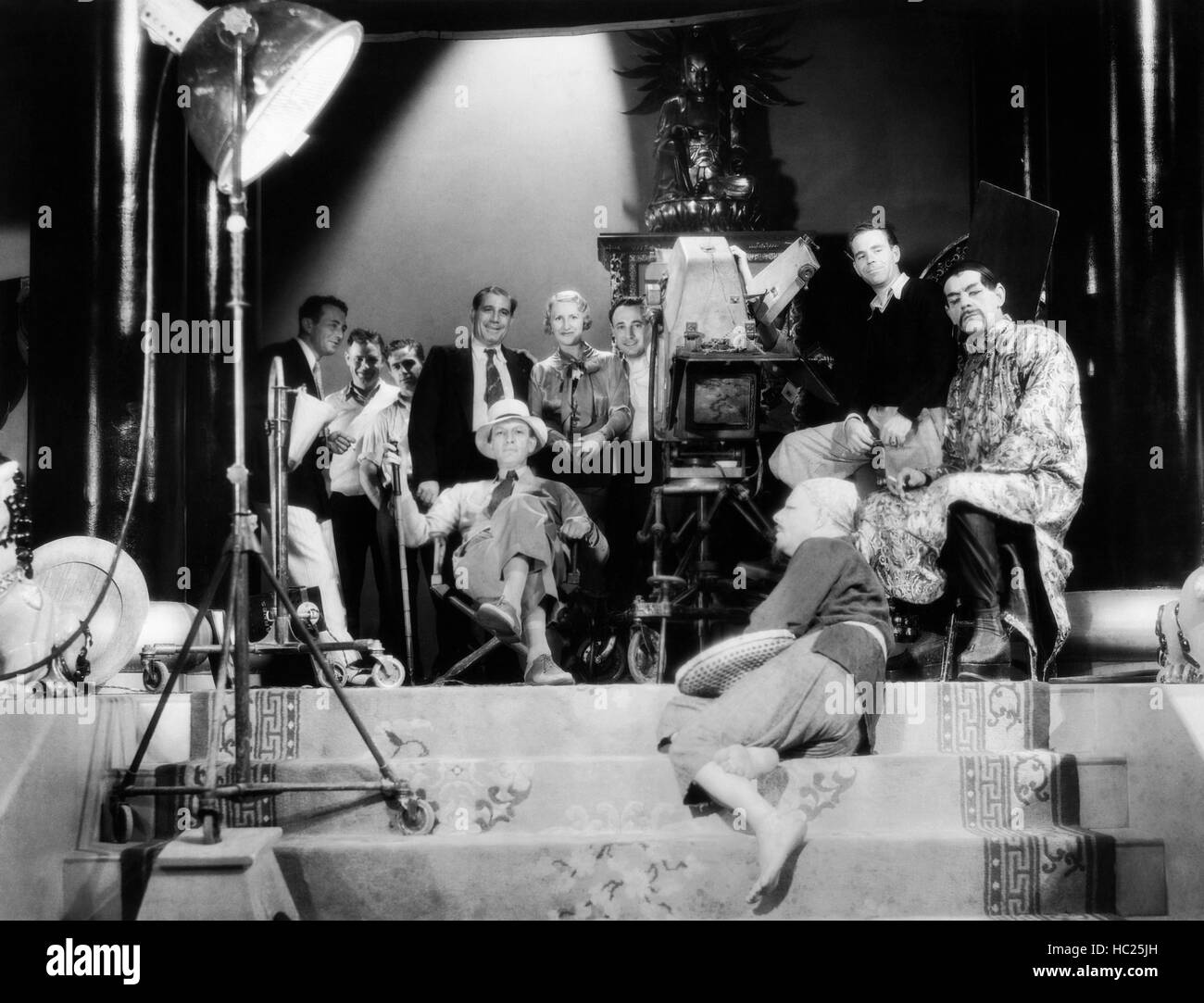 THE MASK OF FU MANCHU, director Charles Brabin (seated center in hat ...