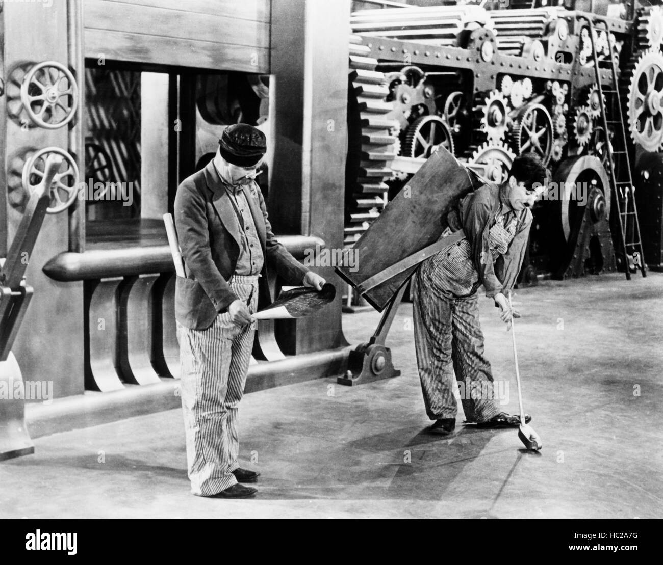 MODERN TIMES, from left, Chester Conklin, Charlie Chaplin, 1936 Stock ...