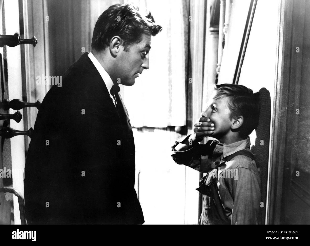 THE NIGHT OF THE HUNTER, Robert Mitchum, Billy Chapin, 1955 Stock Photo ...