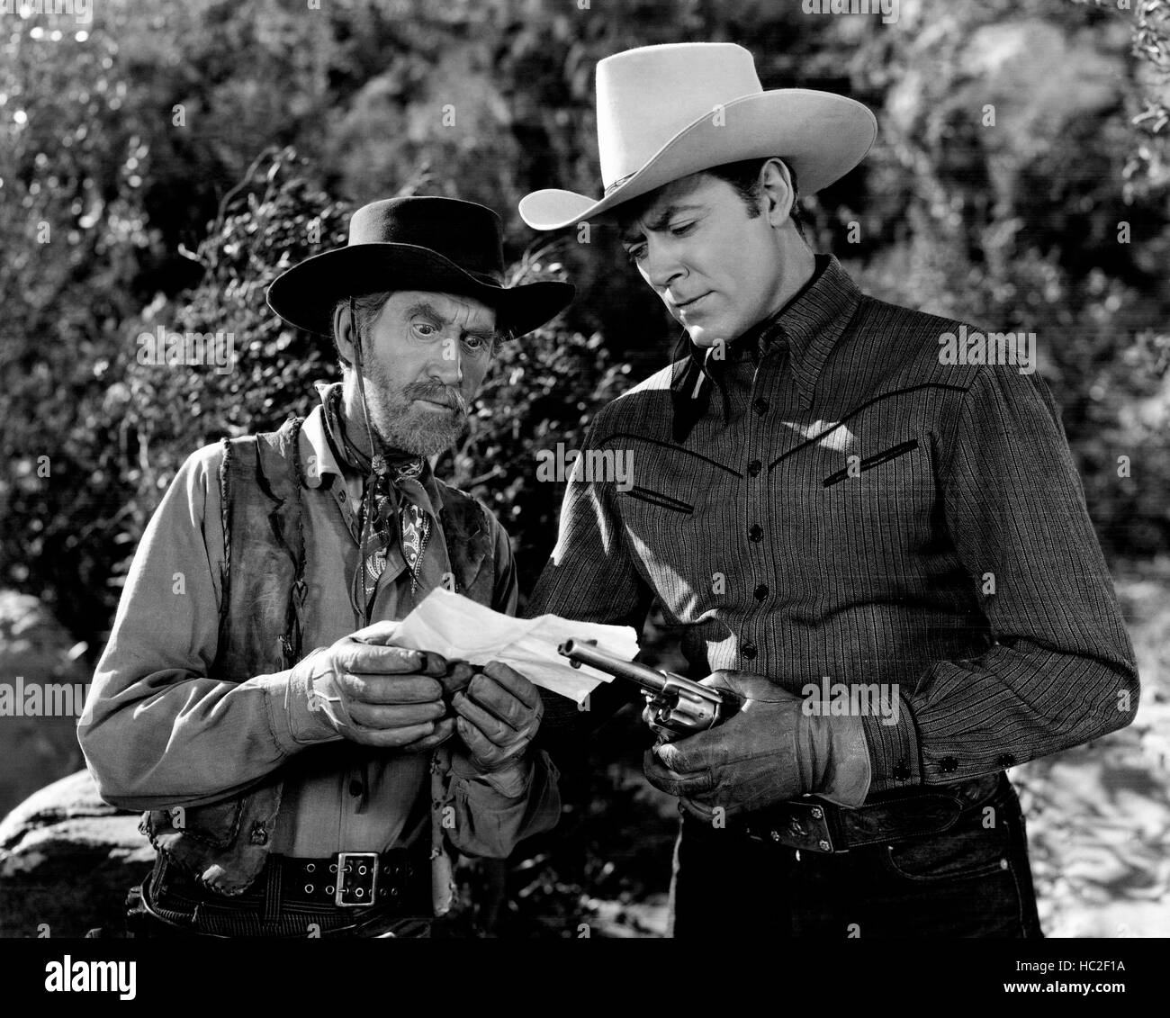 OKLAHOMA BADLANDS, from left: Eddy Waller, Allan Lane, 1948 Stock Photo ...