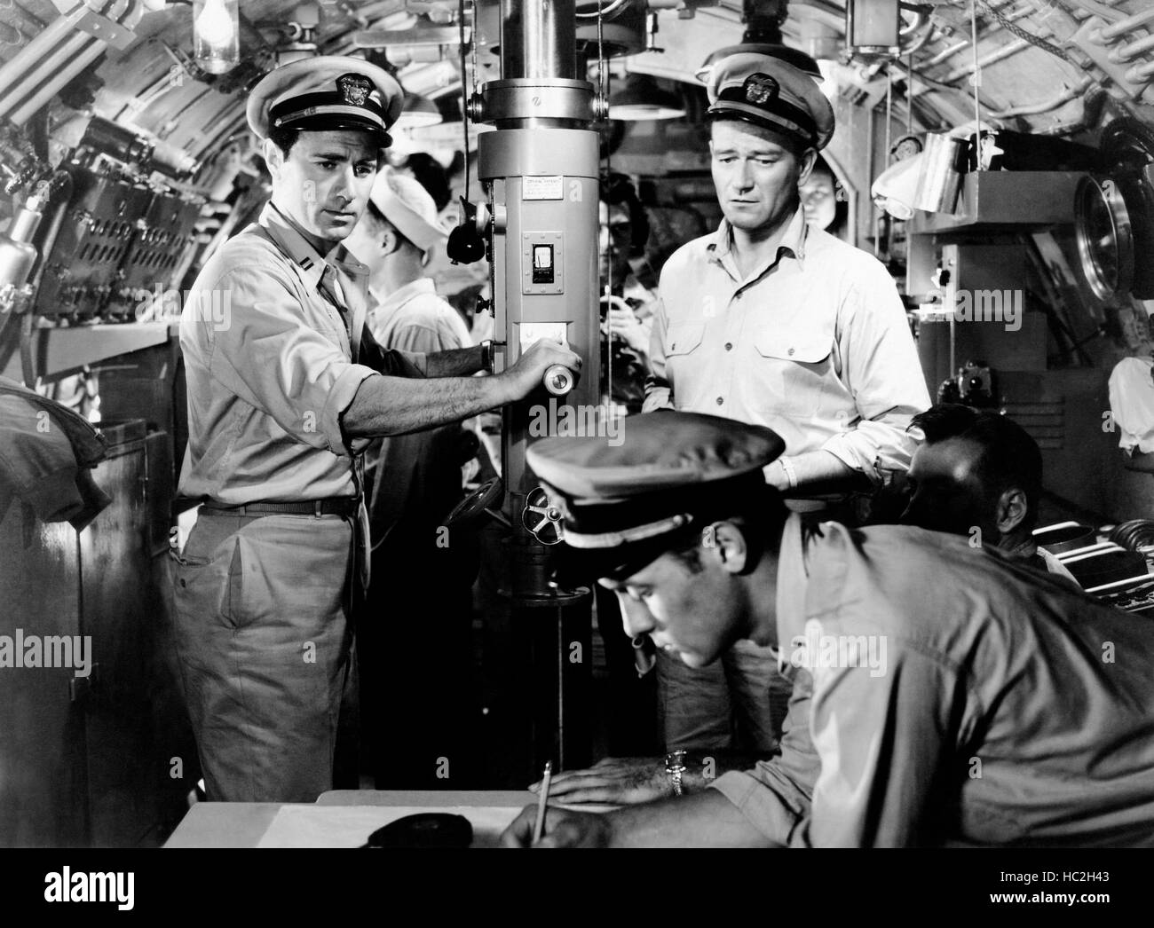 OPERATION PACIFIC, standing from left: Scott Forbes, John Wayne, 1951 ...